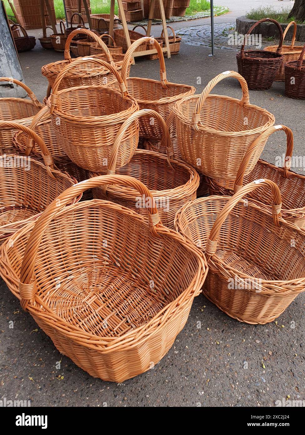 A collection of handmade wicker baskets at an outdoor market Stock ...