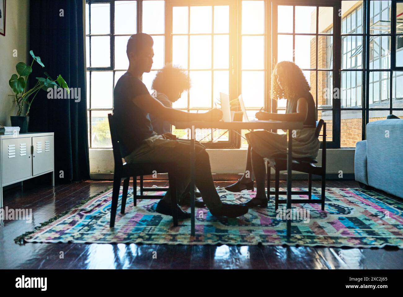 People, sunlight or designers with laptop in meeting for teamwork ...