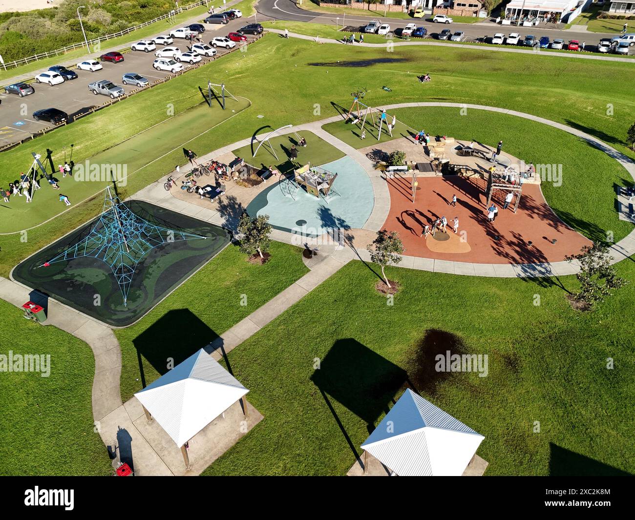 An aerial view of a playground with various play structures and people ...
