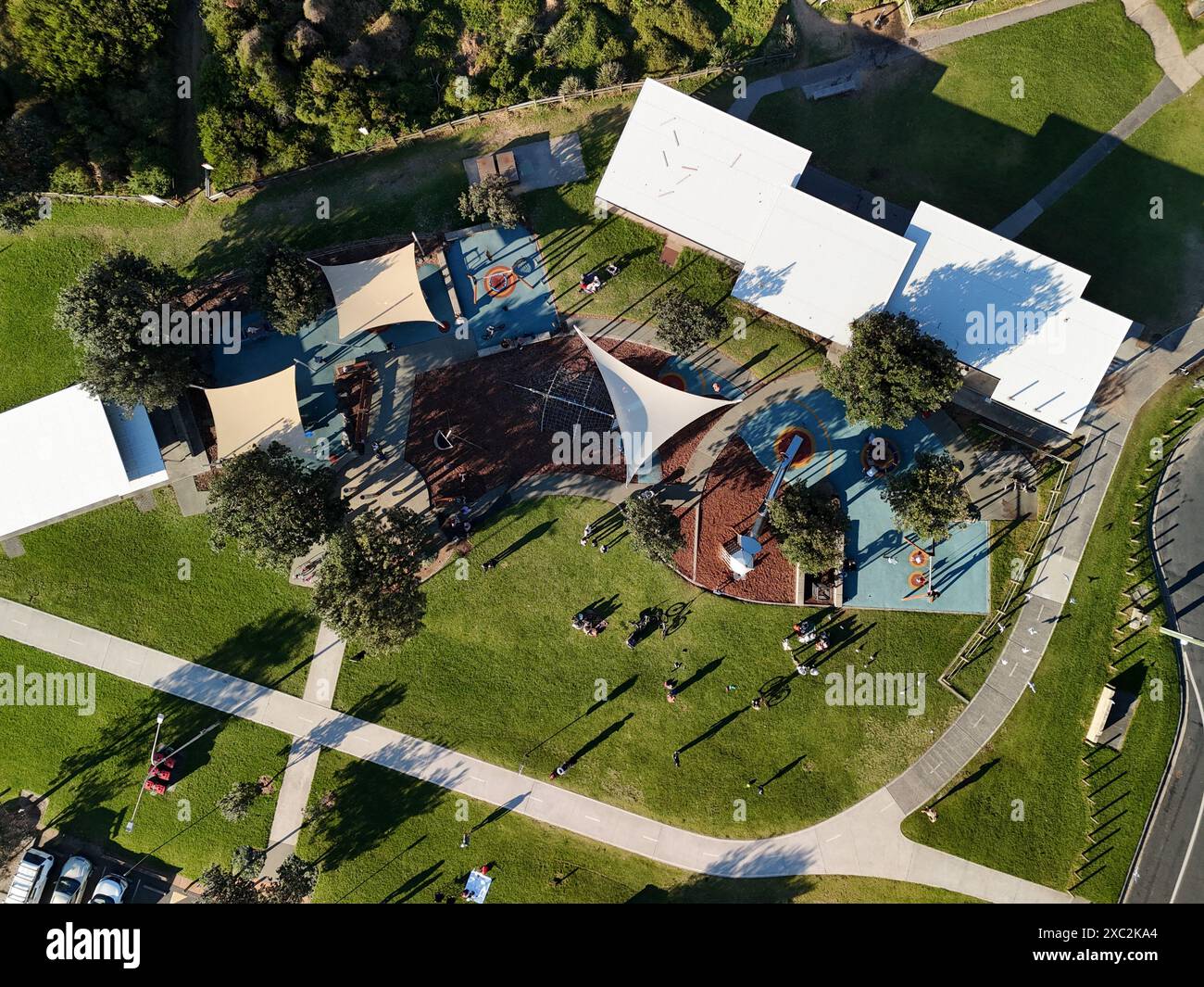 An aerial view of a playground with various play structures and people ...