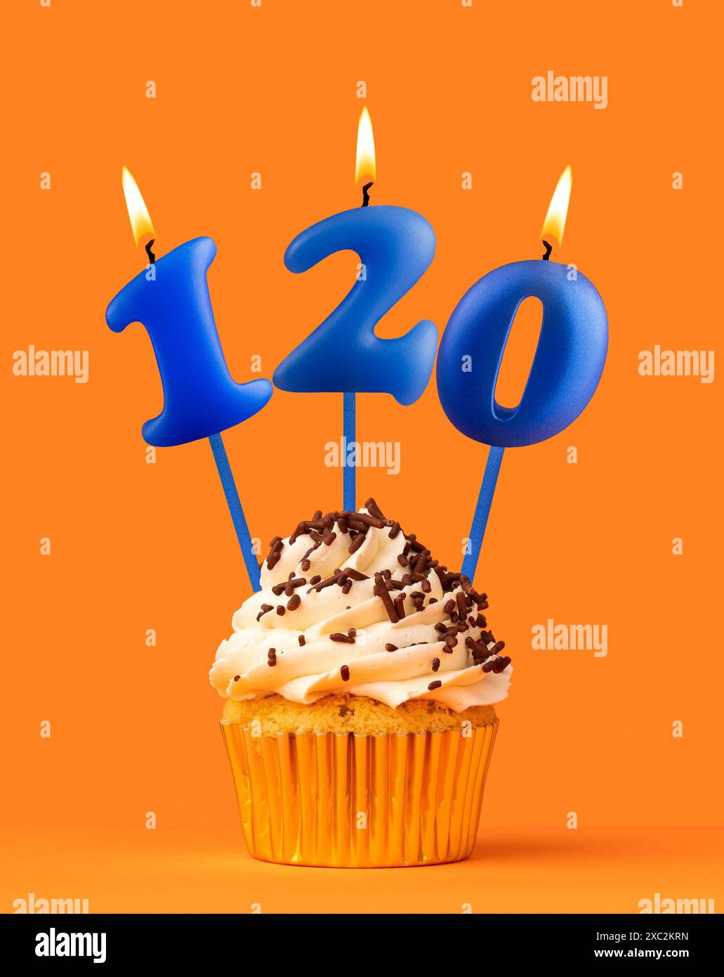 Blue birthday candle and cupcake - Number 120 Stock Photo - Alamy