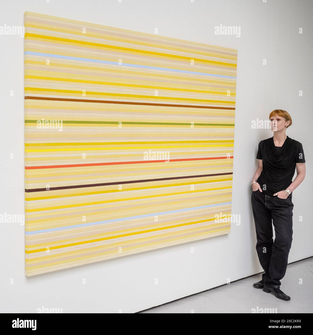 London, UK. 14 June 2024. A staff member with works, 2024, by Fleur ...