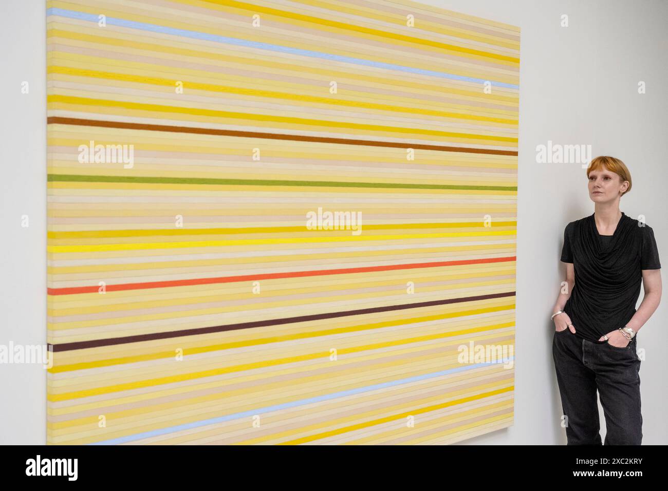 London, UK. 14 June 2024. A staff member with works, 2024, by Fleur ...