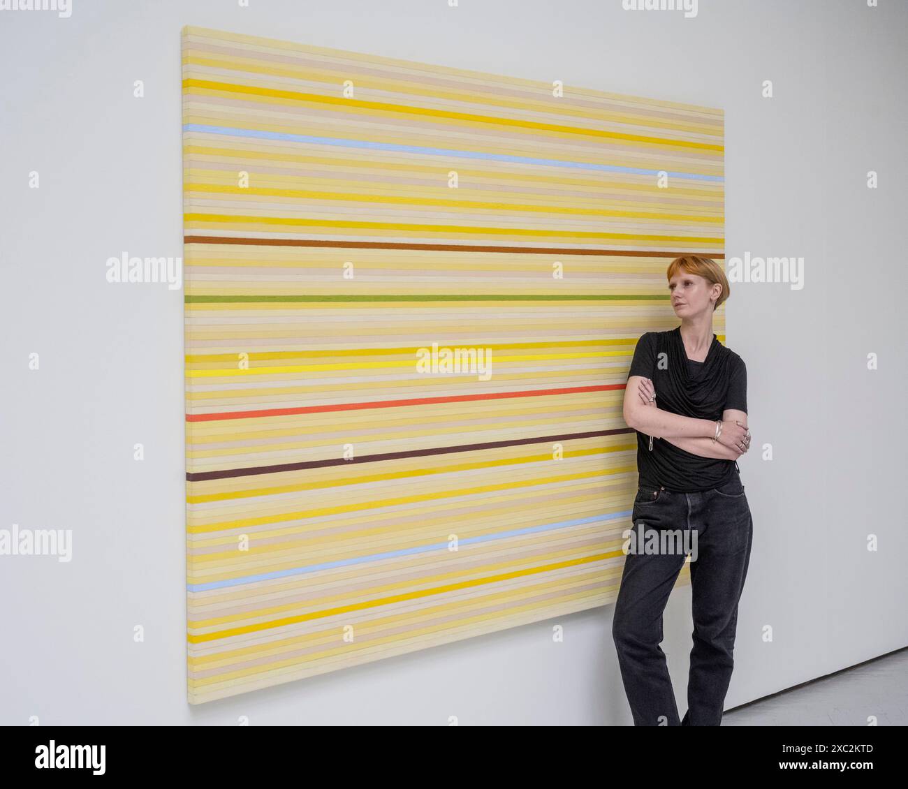 London, UK. 14 June 2024. A staff member with works, 2024, by Fleur ...