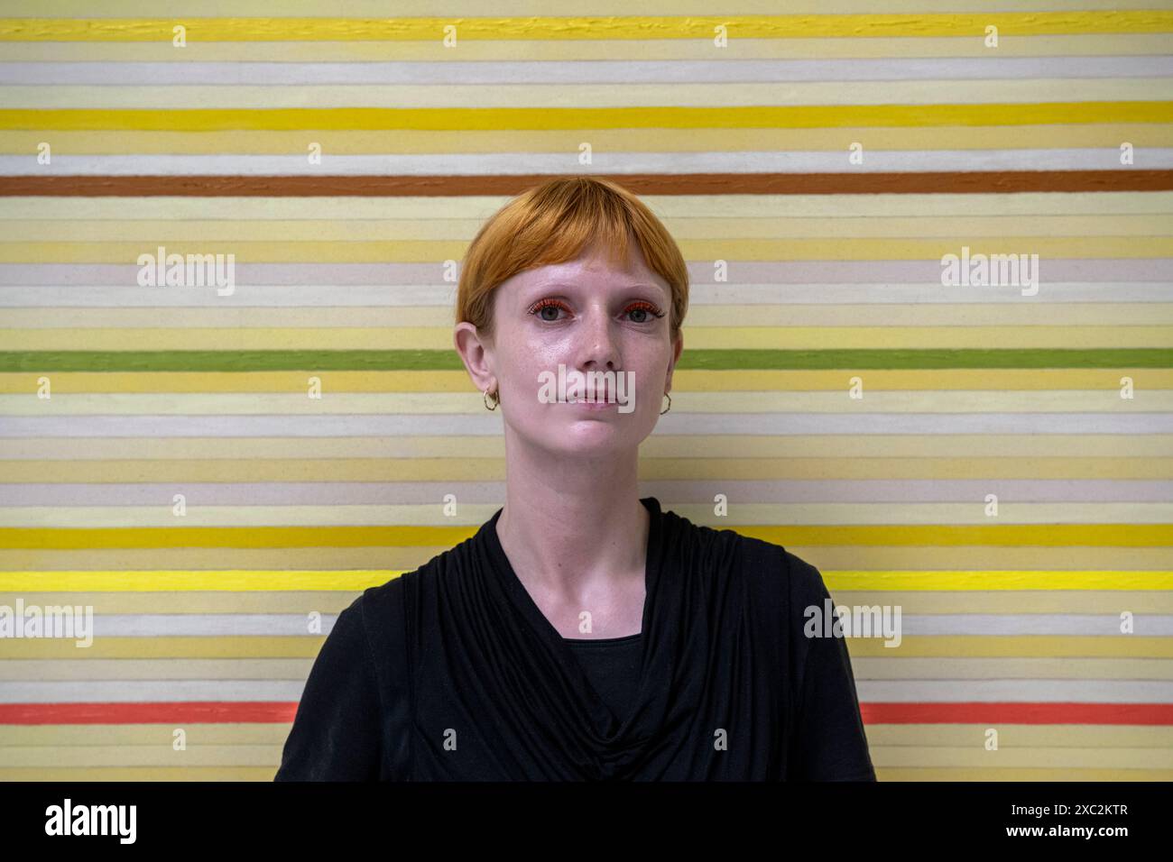 London, UK. 14 June 2024. A staff member with works, 2024, by Fleur ...