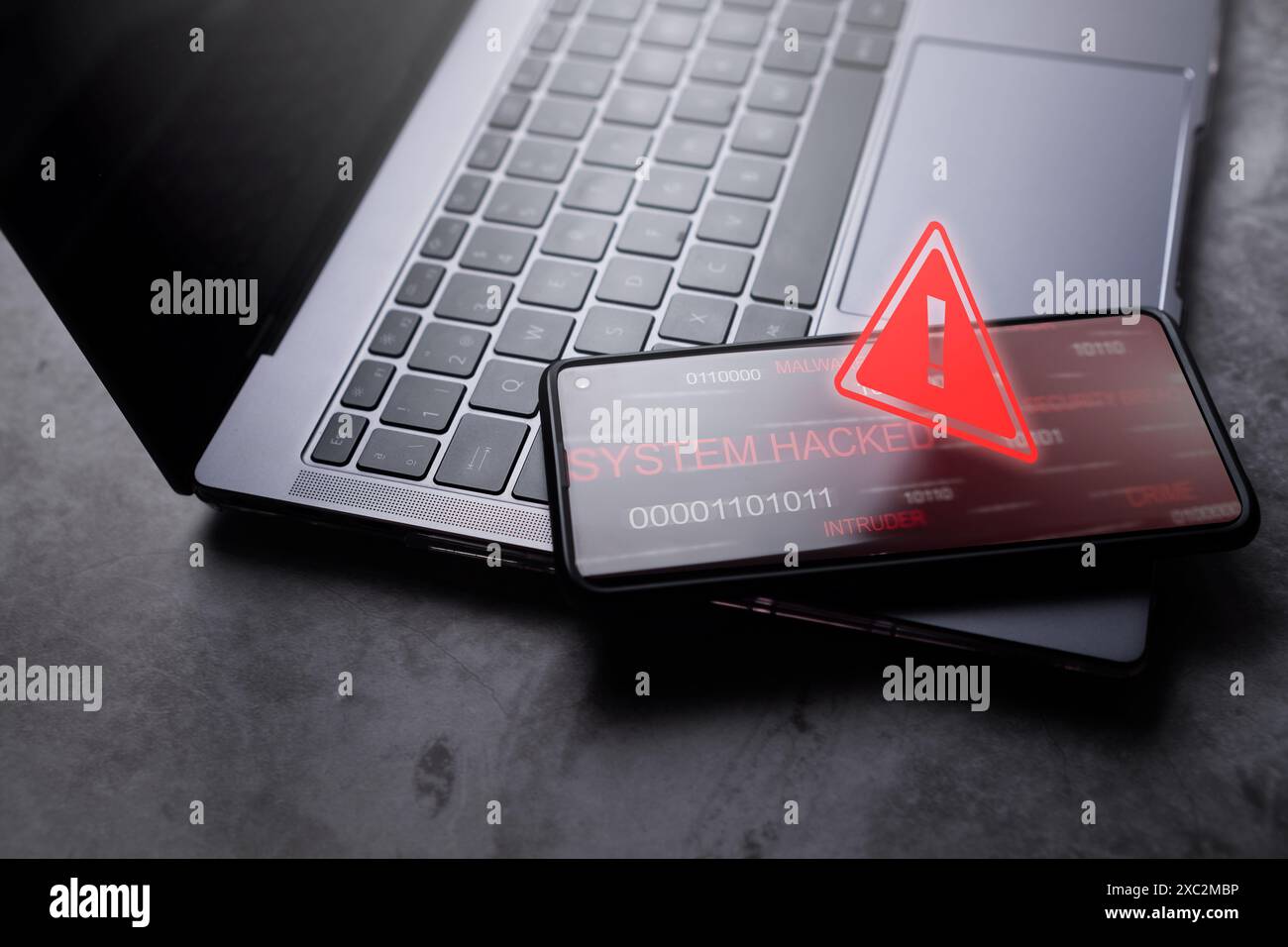 Smartphone Laying On Laptop With Red Warning Notification System Warning Hacked Alert