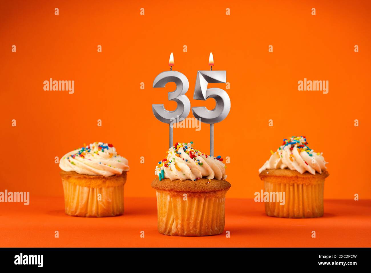 Candle number 35 - Celebration with birthday cupcake on orange ...