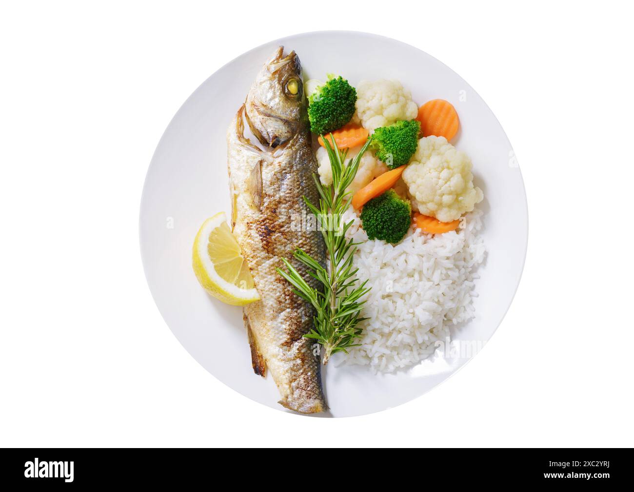 plate of fried fish, rice and vegetables isolated on a white background ...