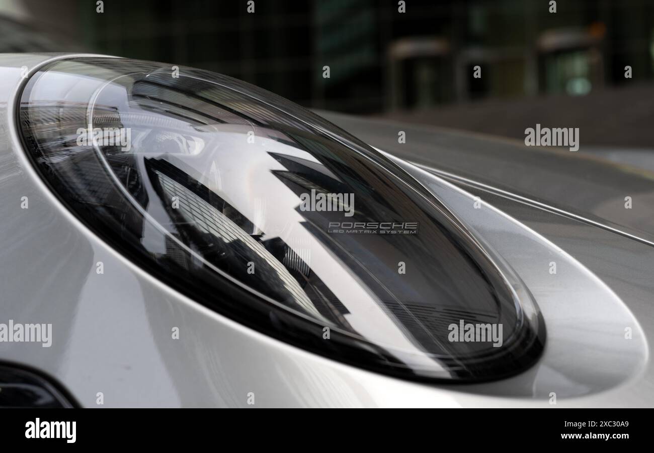 Close-up of a Porsche LED Matrix System headlight with reflections of ...