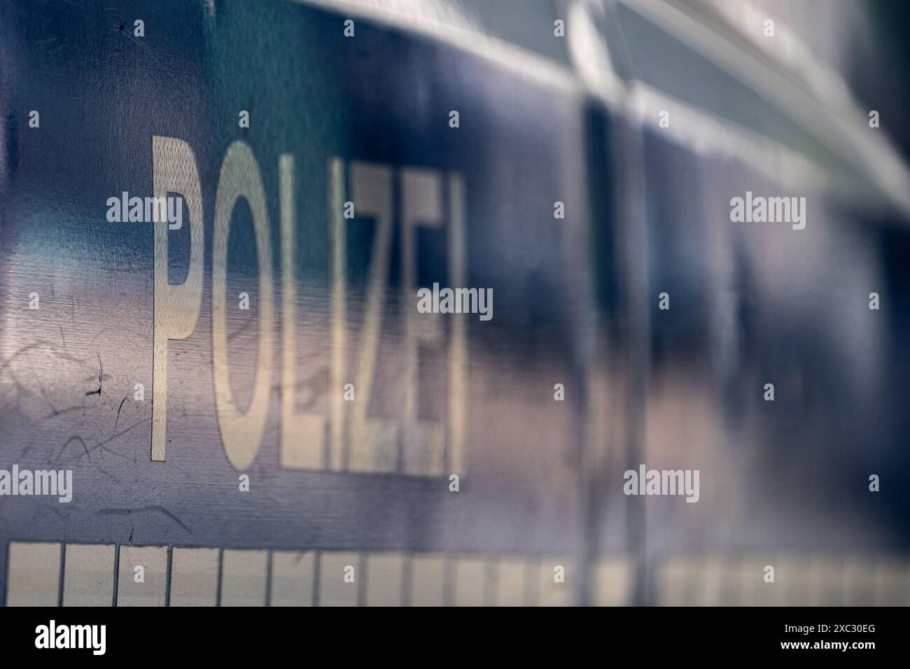 A close-up of a German police vehicle with the word 'Polizei' on the ...