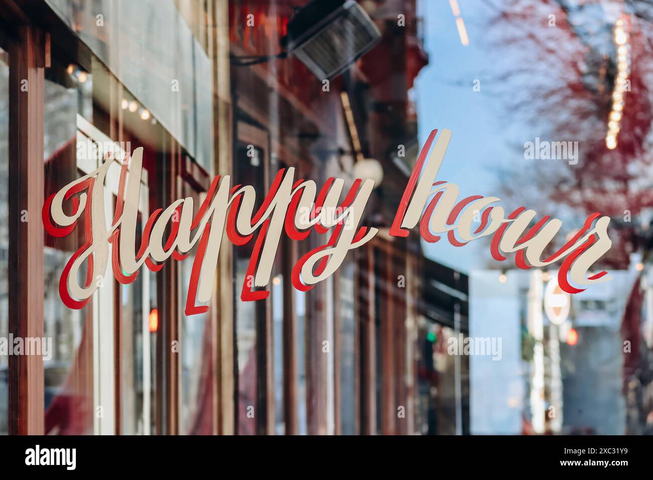 "Happy Hour" sign on a restaurant terrace window in Paris Stock Photo ...