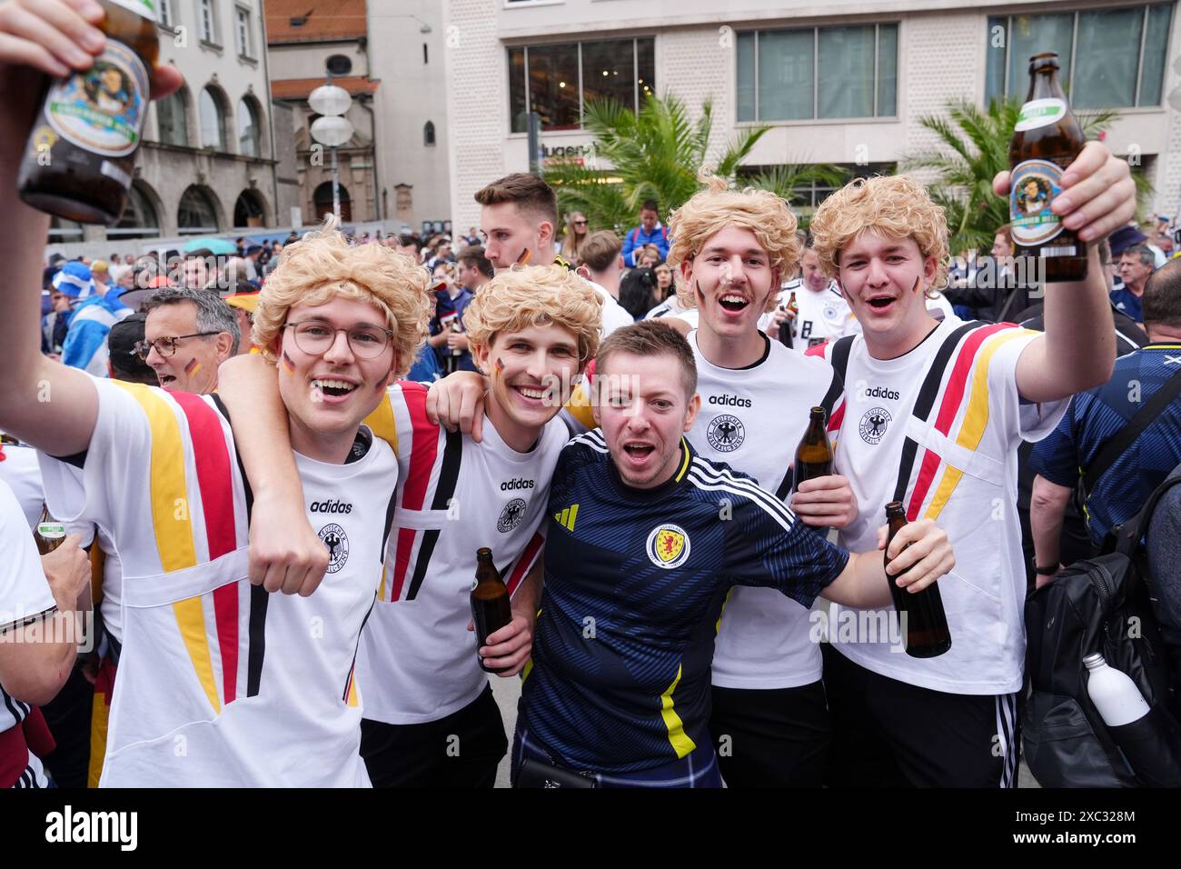 Scotland and Germany fans pose for a photo at Marienplatz square ...