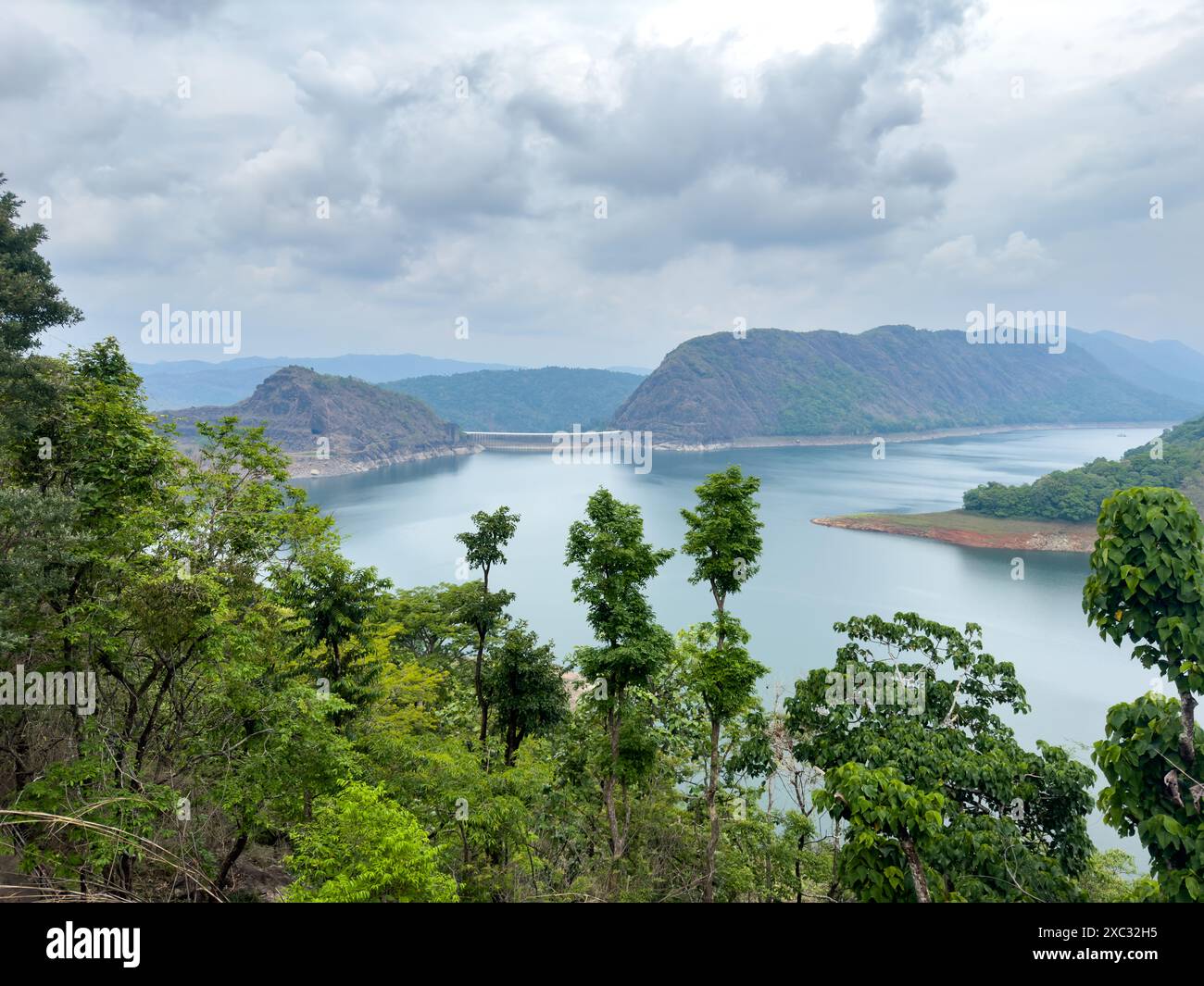 Beautiful view through the trees of the Idukki dam built across Periyar river, Idukki district ...