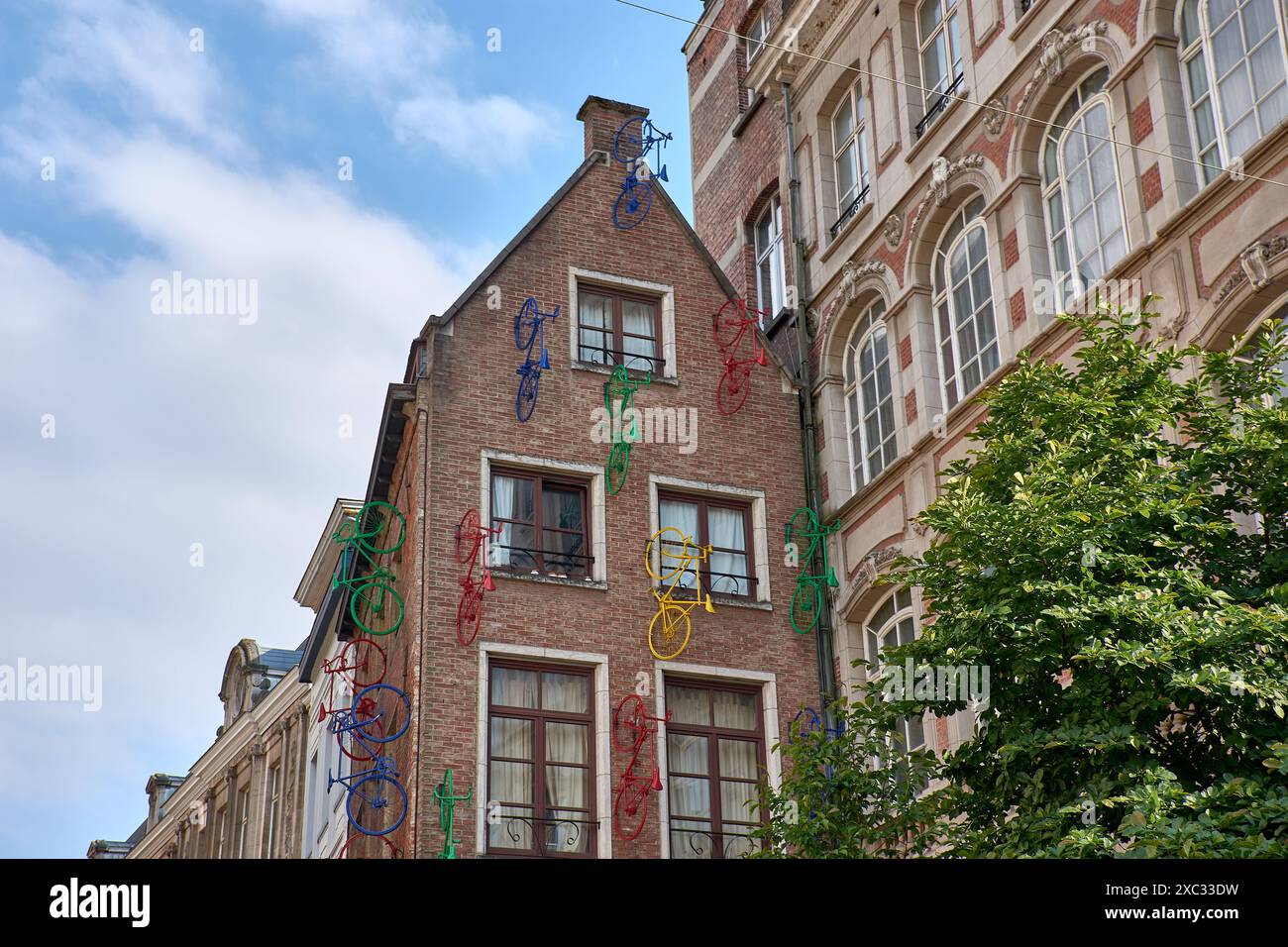 Bicycles in many colors attached to the house close to Manneken Pis ...