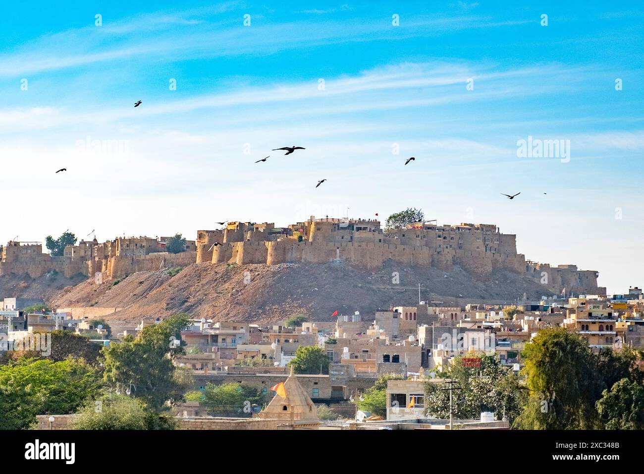 afternoon view to historic Jaisalmer fort with birds in the sky Stock ...