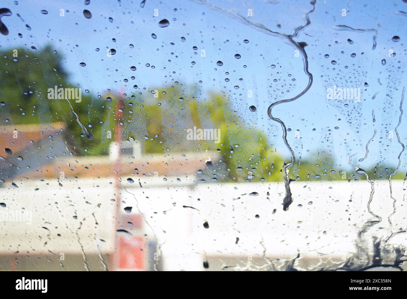 Soap stains flow down the windshield of the car. Photo from inside the ...