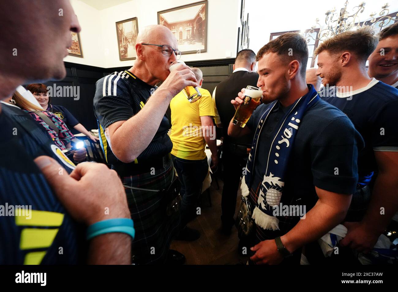 Scotland fan Craig Ferguson (right), who has walked from Scotland to ...