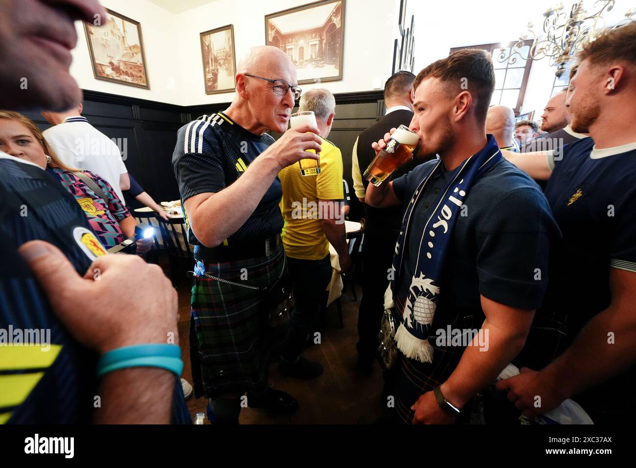 Scotland fan Craig Ferguson (right), who has walked from Scotland to ...