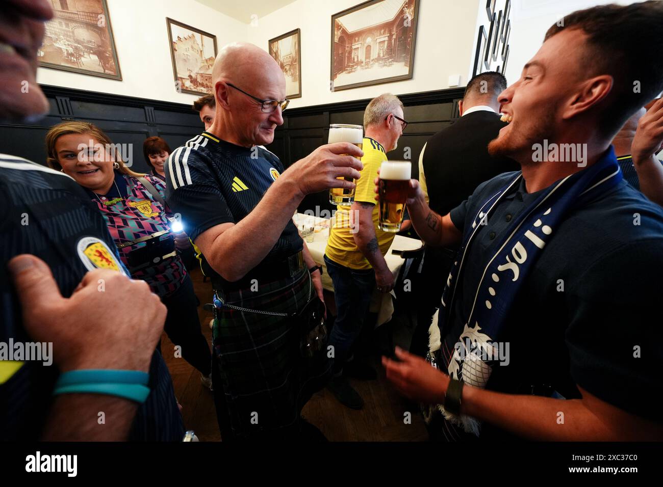 Scotland fan Craig Ferguson (right), who has walked from Scotland to ...