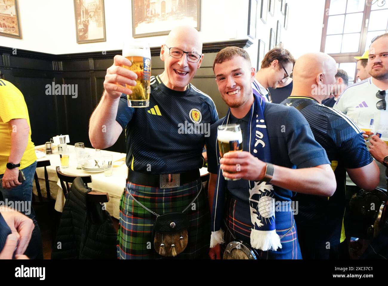 Scotland fan Craig Ferguson (right), who has walked from Scotland to ...