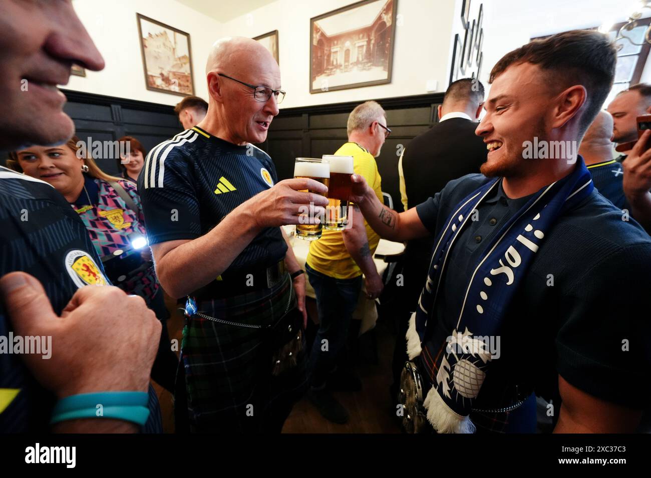 Scotland fan Craig Ferguson (right), who has walked from Scotland to ...