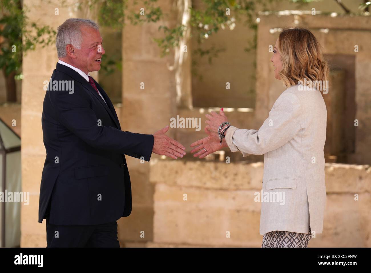 King Abdullah II bin Al-Hussein of Jordan is greeted by Italian Prime Minister Giorgia Meloni ...