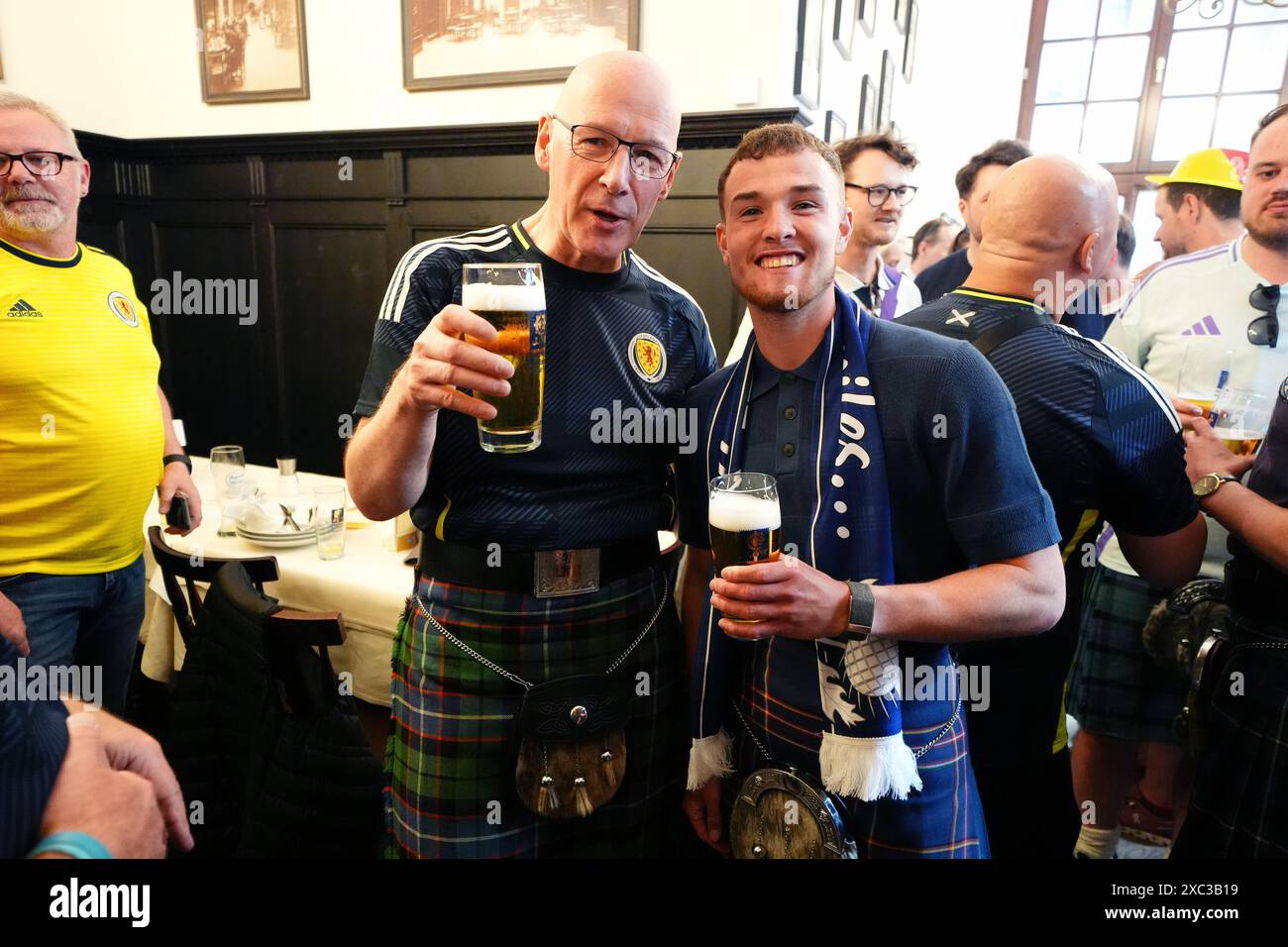 Scotland fan Craig Ferguson (right), who has walked from Scotland to ...