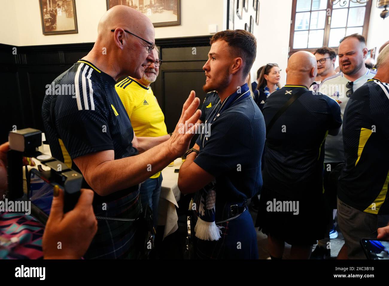 Scotland fan Craig Ferguson (right), who has walked from Scotland to ...
