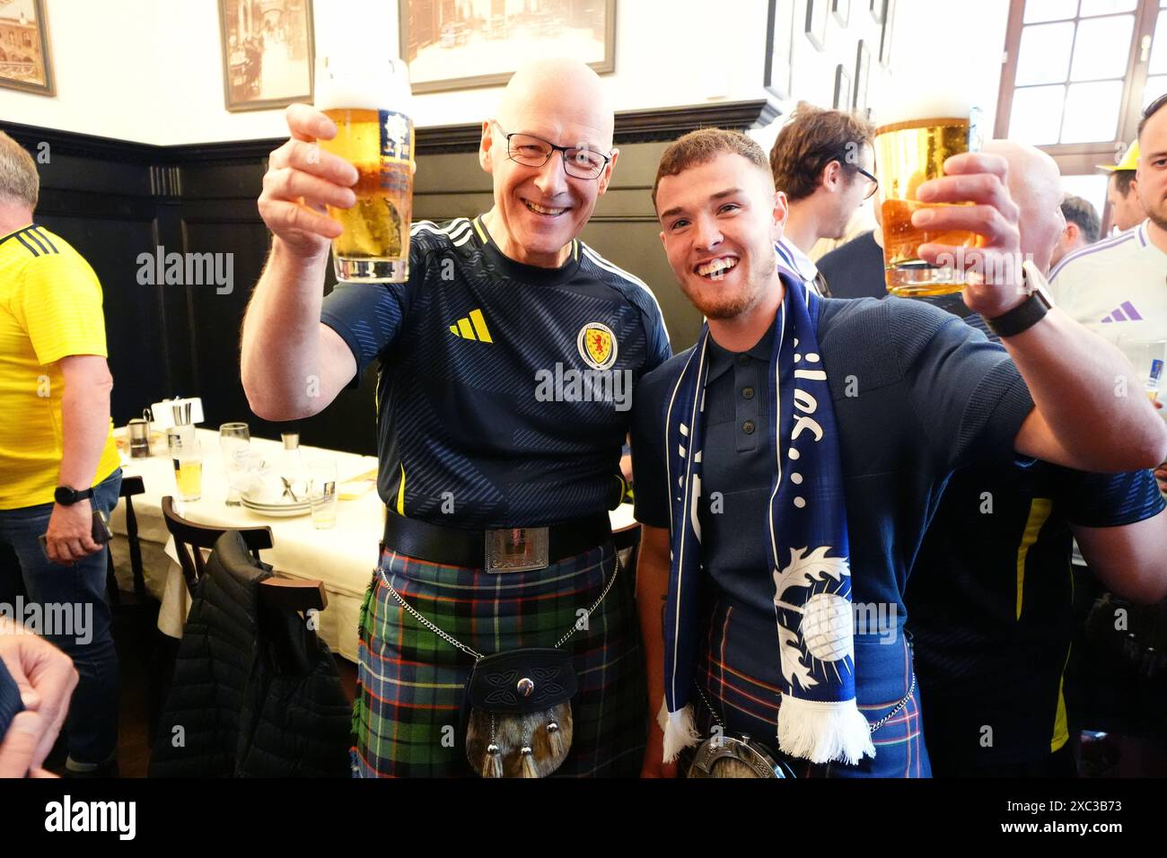 Scotland fan Craig Ferguson (right), who has walked from Scotland to ...