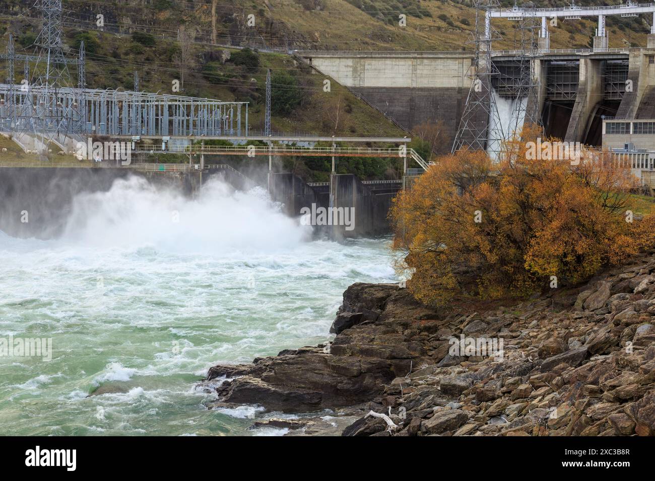 Water pours from a spillway at the Roxburgh Hydro Damn on the Clutha ...