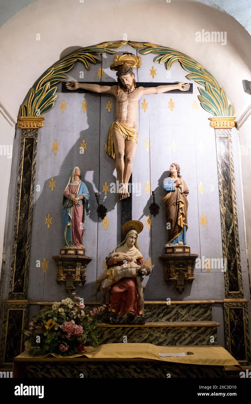 Crucifix with Jesus on the cross on the altar of the church of Santa ...