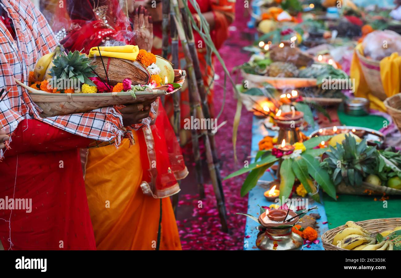 indian devotee worshiping hindu holy sun god with fruits and flowers at ...