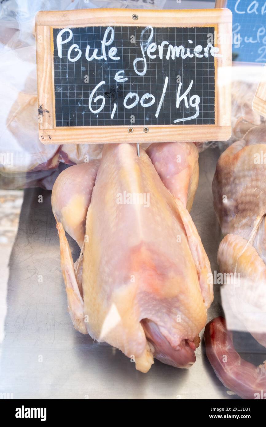 Sale of poultry, free-range chicken, at the market in the medieval ...