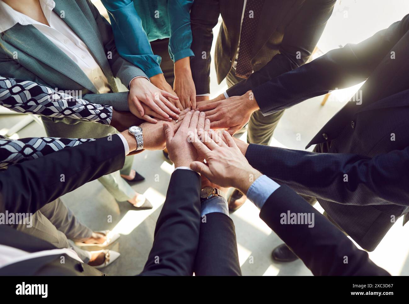 Close up top view photo of diverse business people putting their arms together in stack Stock ...