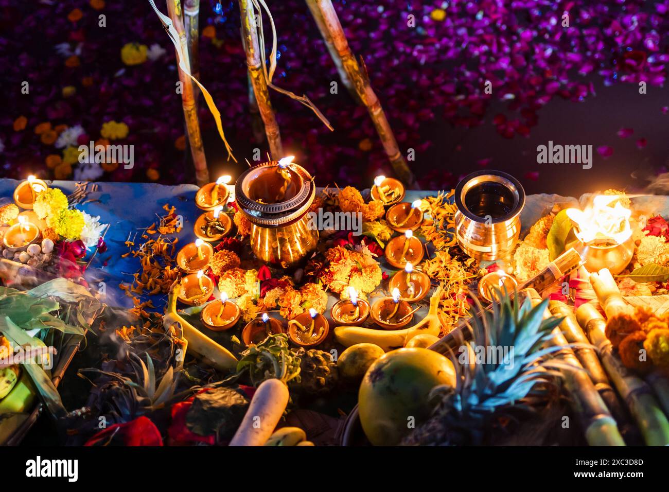 traditional holy offerings of burning oil lamp at river side at chhath ...