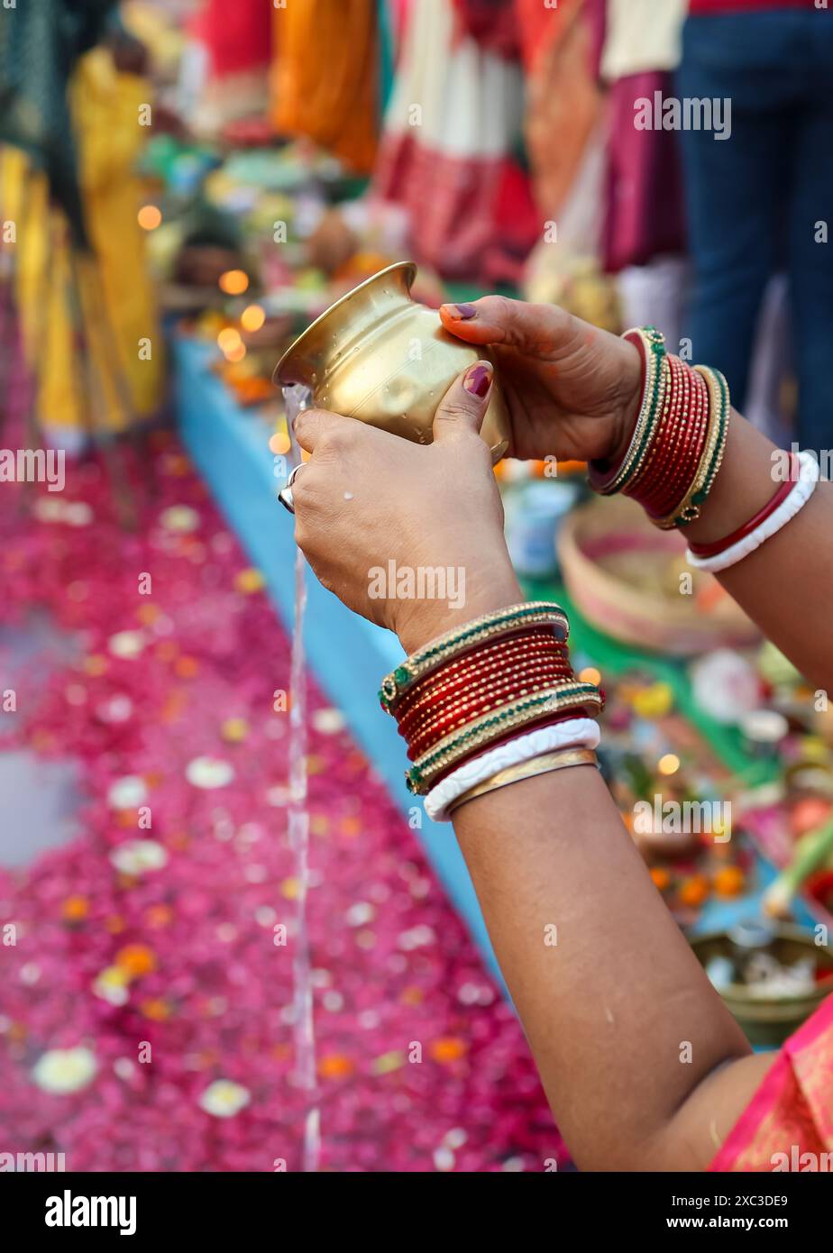 holy water offerings by indian devotee doing traditional rituals at ...