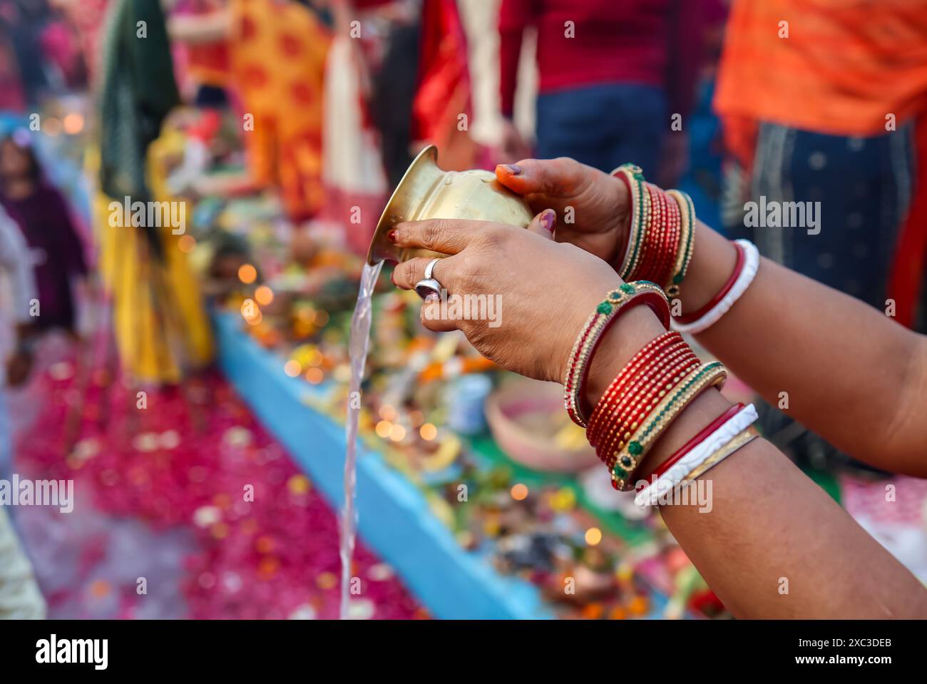 holy water offerings by indian devotee doing traditional rituals at ...