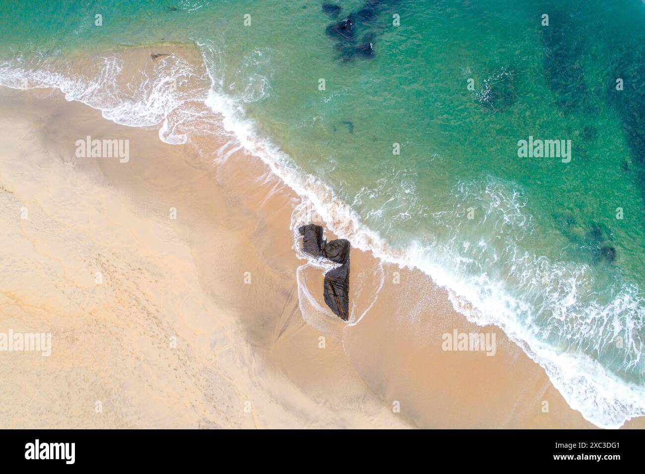aerial drone view of a beach with a rock, top view photo Stock Photo ...