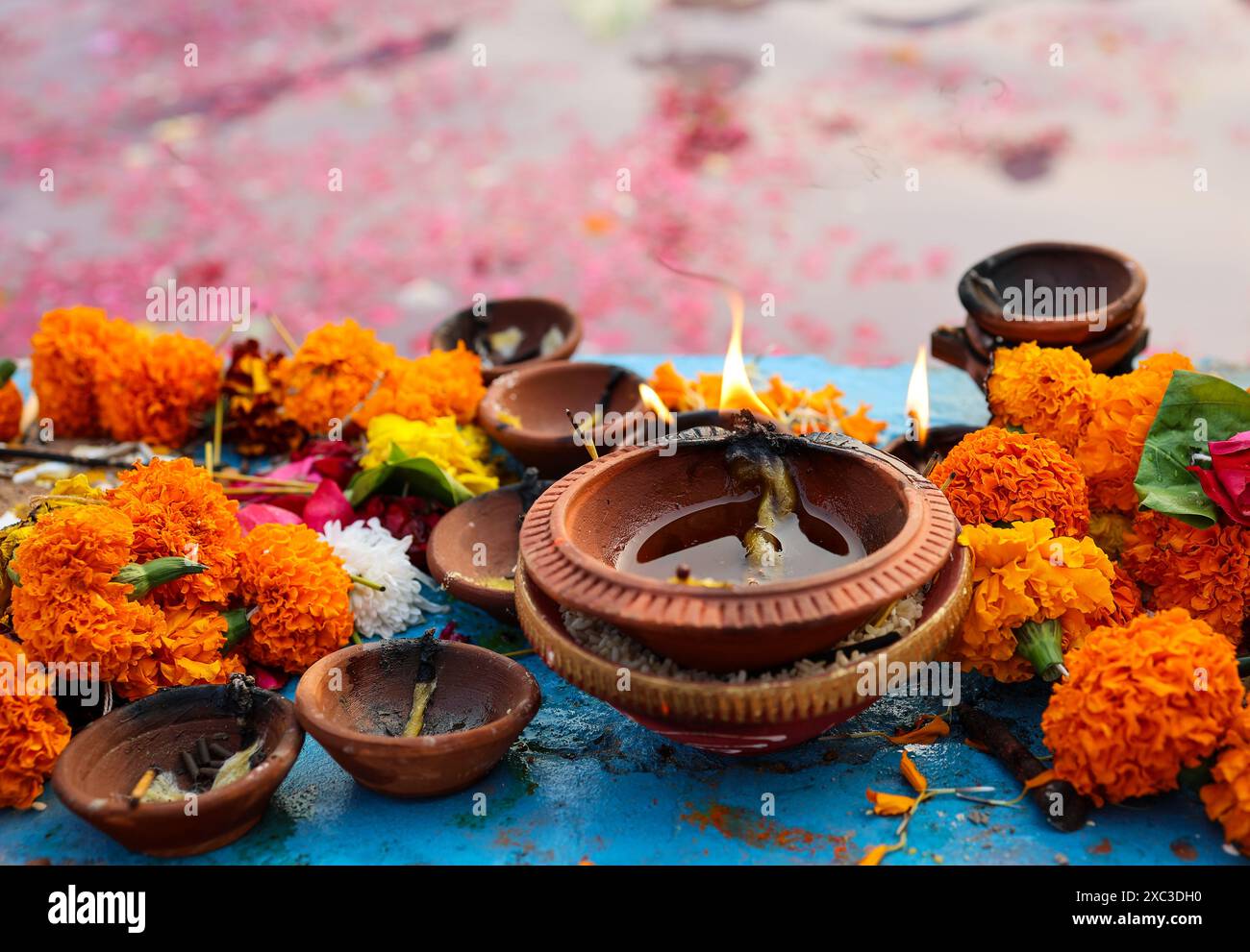 holy offerings of burning clay oil lamp for hindu god at festival from ...