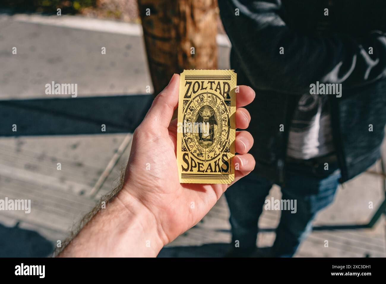 Holding a Zoltar Fortune card in a hand Stock Photo - Alamy