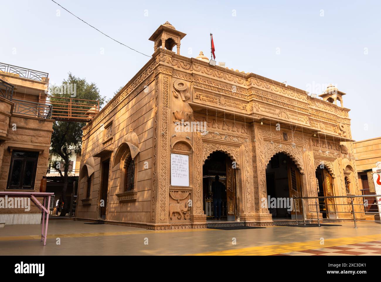 ancient hindu temple made of red stone at day from different angle ...
