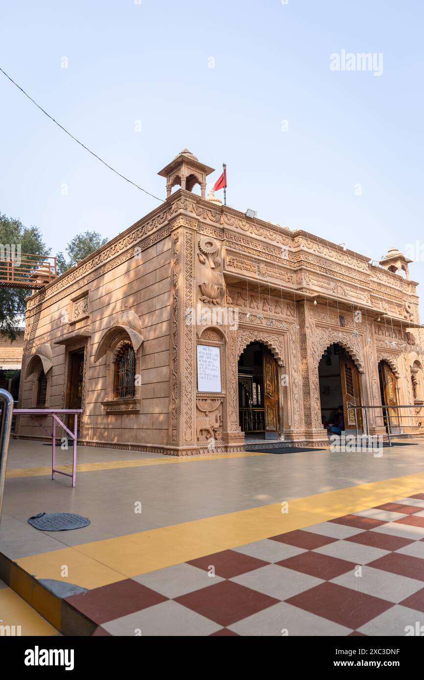 ancient hindu temple made of red stone at day from different angle ...