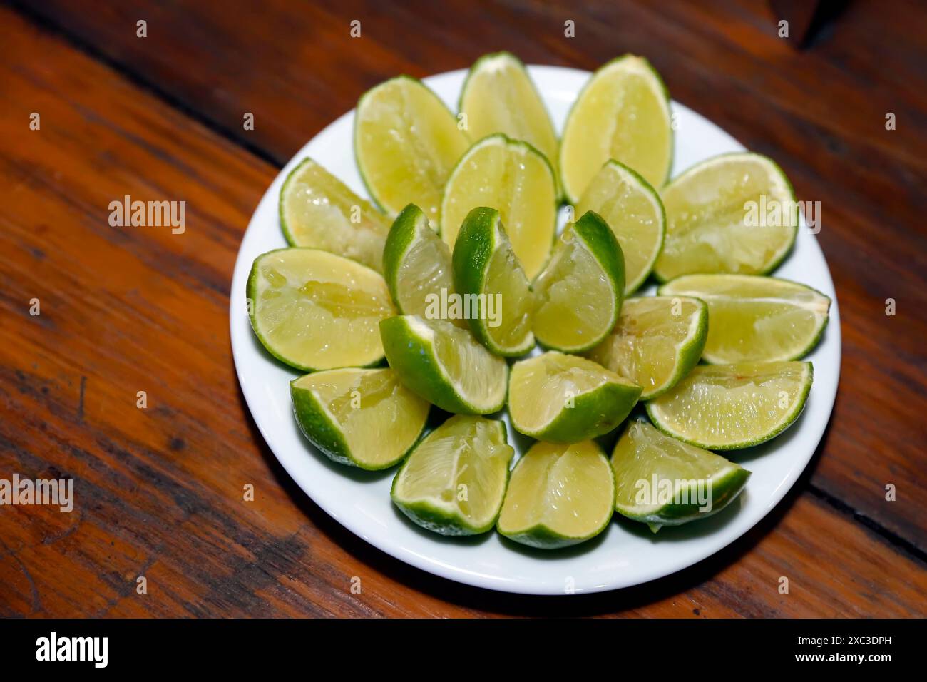 green fruit lemons cut into bowl and ready to serve Stock Photo - Alamy