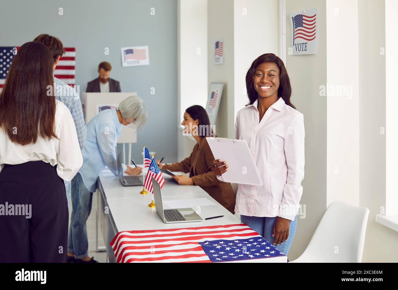 Portrait of a happy african american woman employee work in USA voting ...