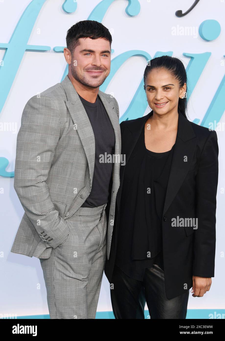 LOS ANGELES, CALIFORNIA - JUNE 13: (L-R) Zac Efron and Bela Bajaria ...