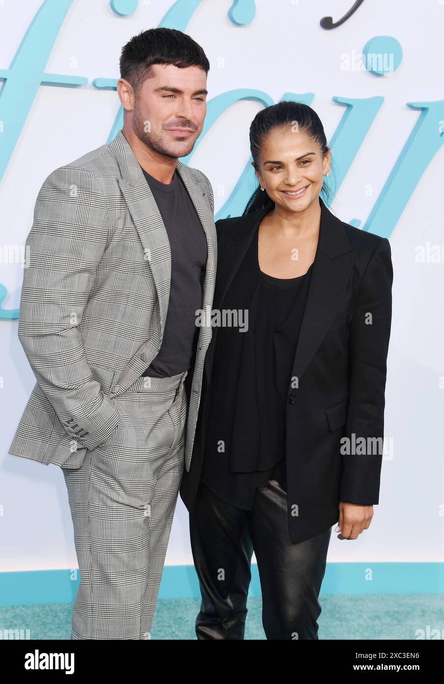LOS ANGELES, CALIFORNIA - JUNE 13: (L-R) Zac Efron and Bela Bajaria ...