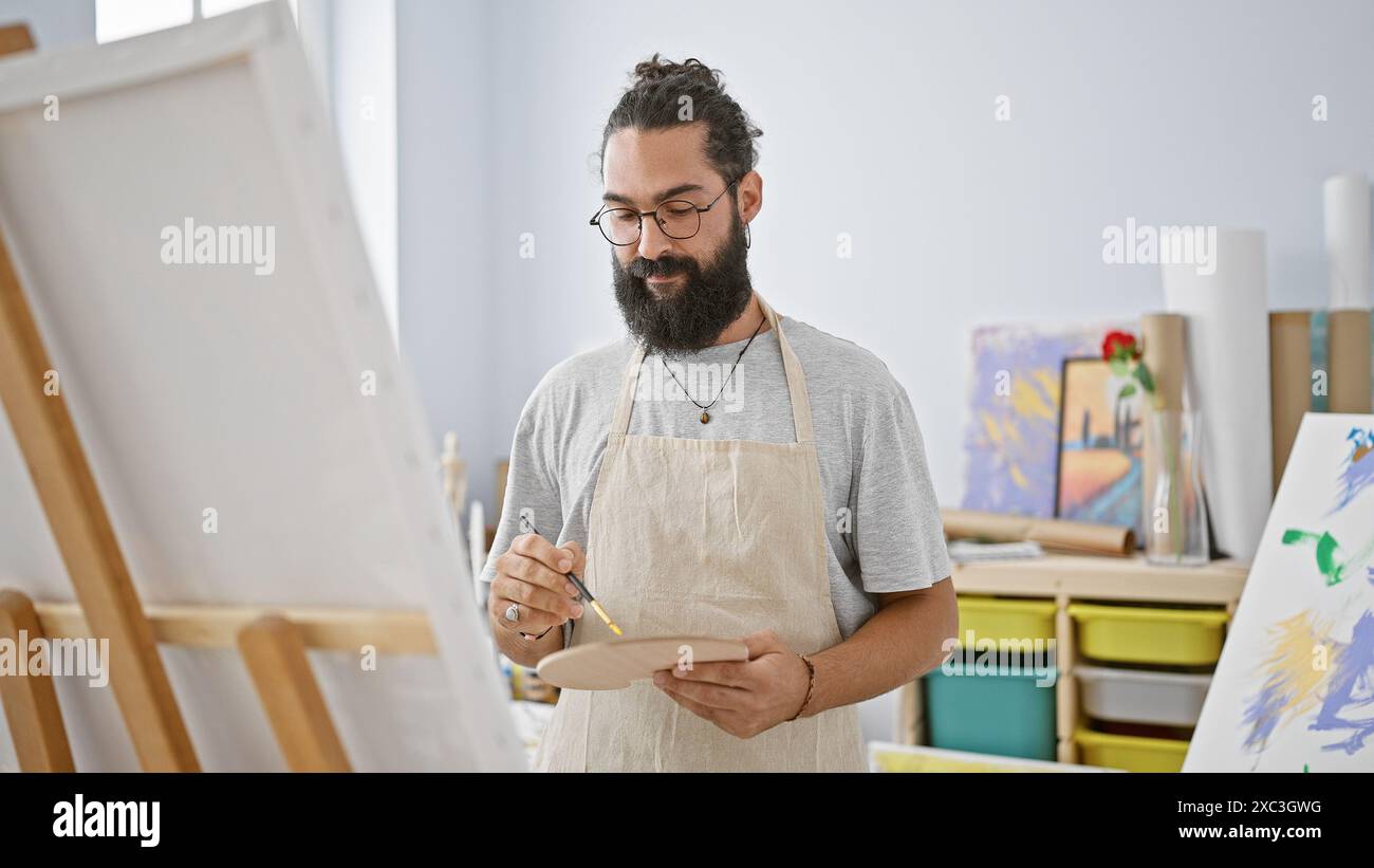 Handsome bearded man painting on hi-res stock photography and images ...
