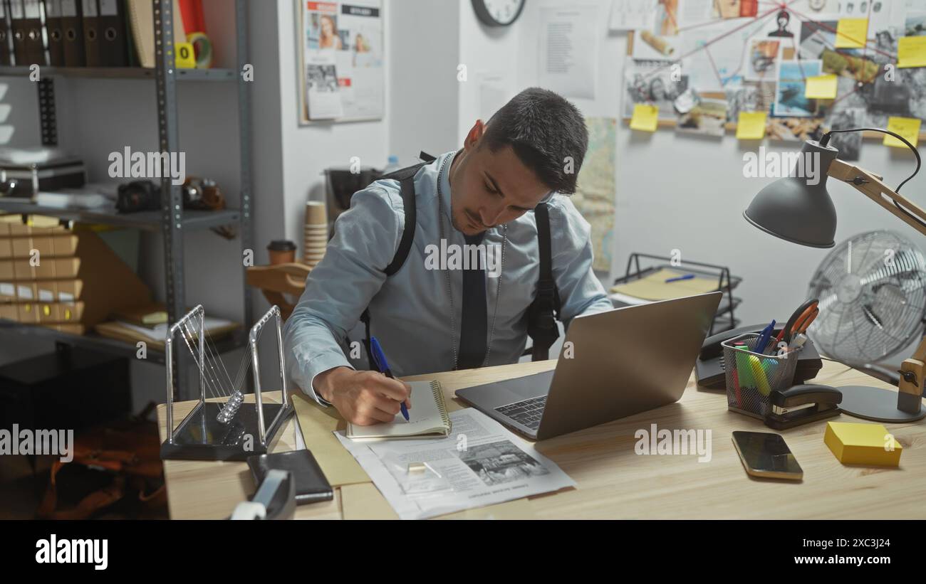 Hispanic detective taking notes at police station with evidence board ...
