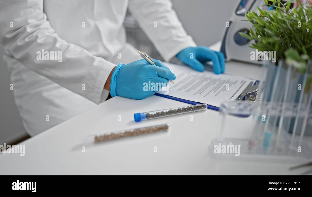 A healthcare professional in gloves signs documents at a laboratory ...