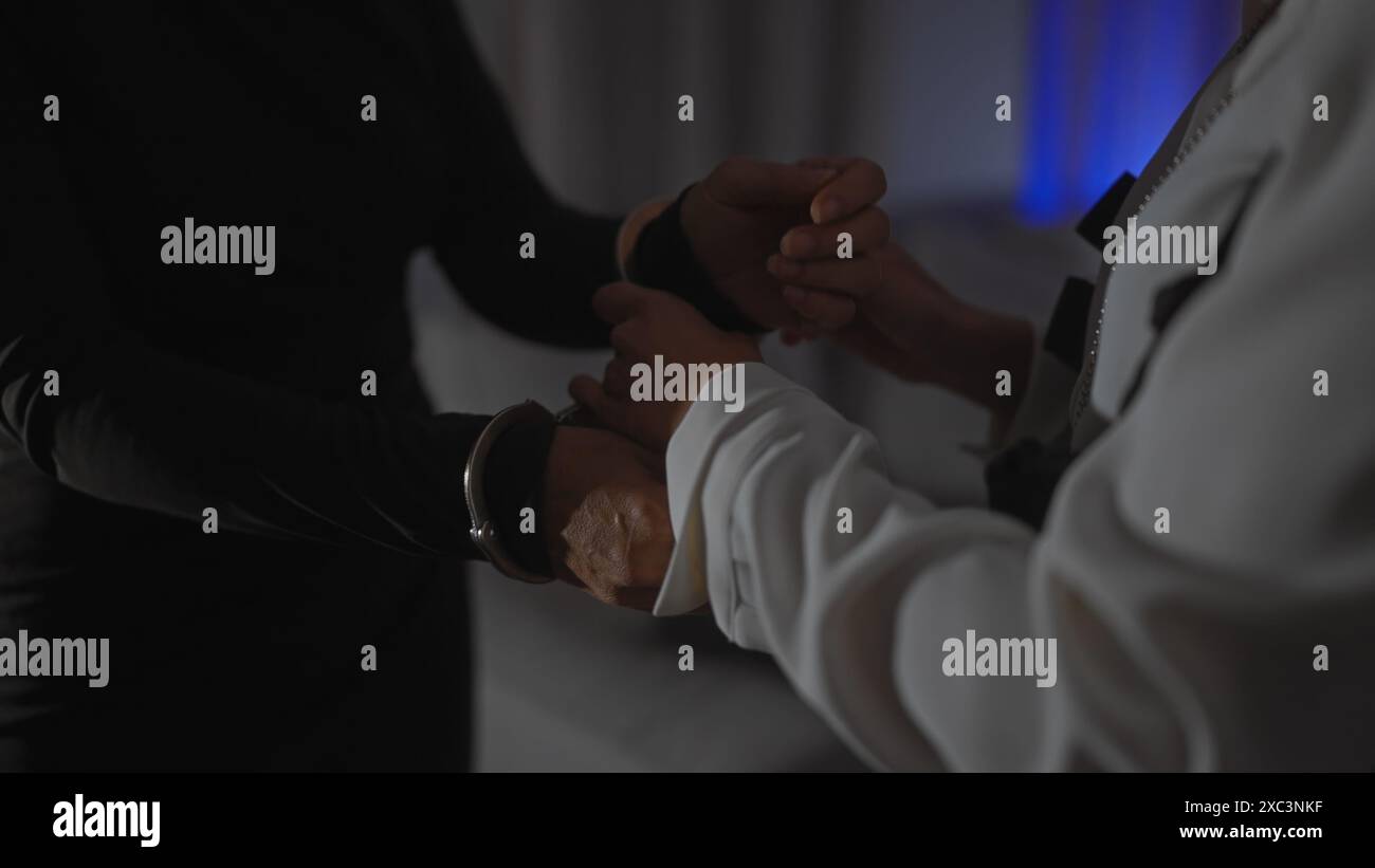 Woman hands in handcuffs behind back hi-res stock photography and ...